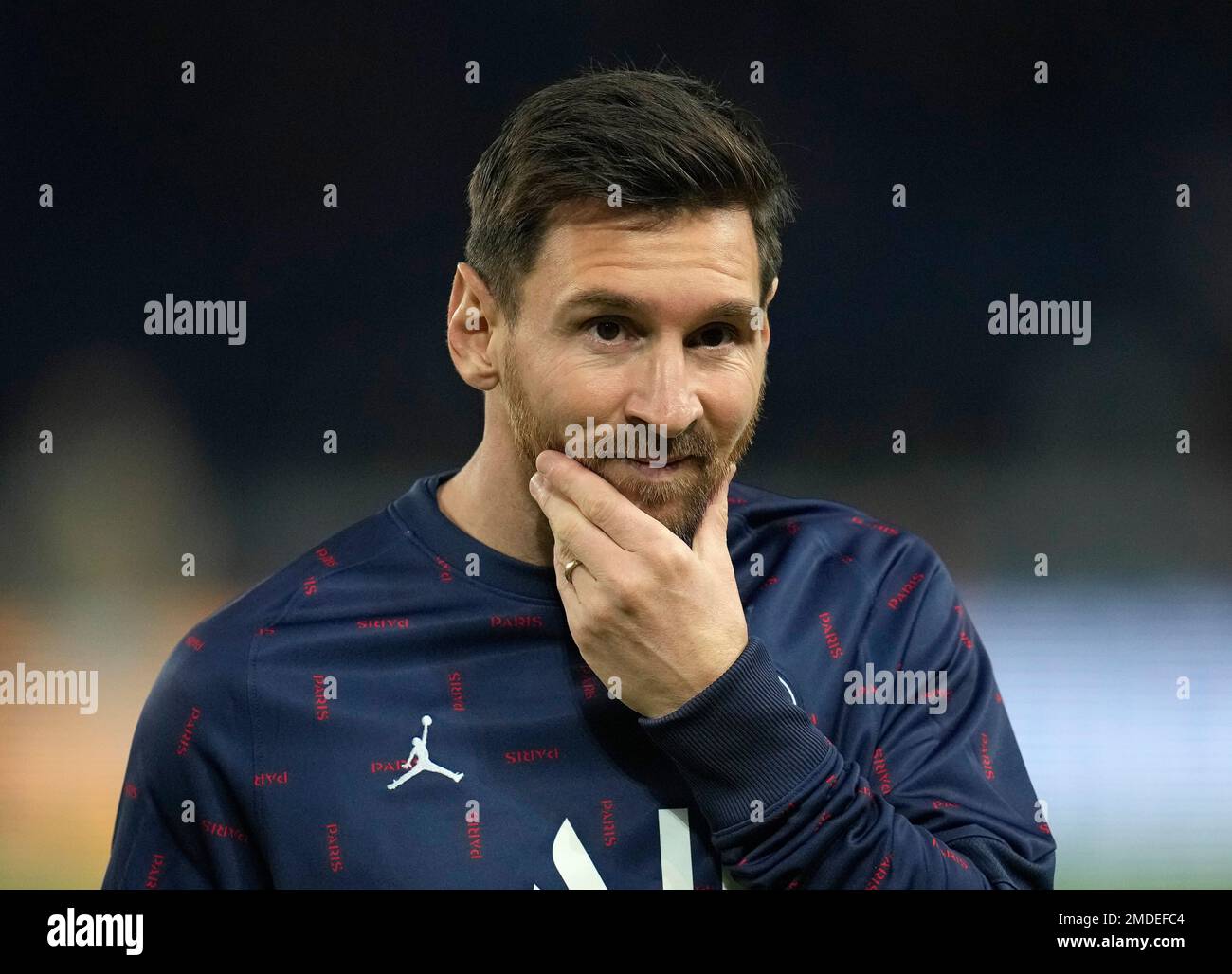 PSG''s Lionel Messi strokes his chin during the warm-up before the ...