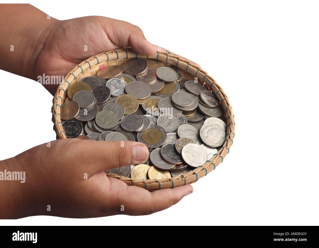 Coins in a bamboo basket on a white background.Saving money concept ...