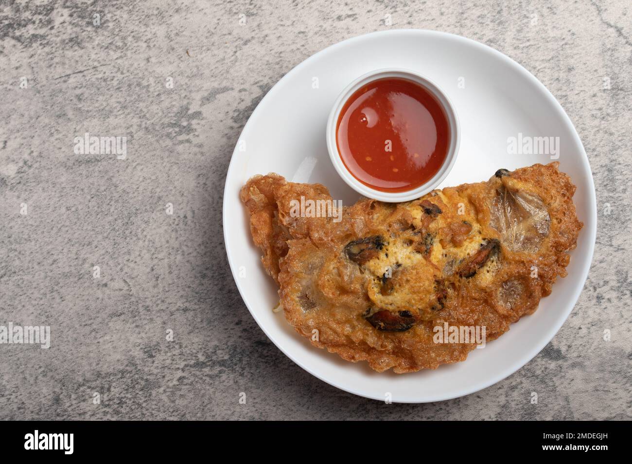 Fried mussels in crispy batter in a white plate Stock Photo - Alamy