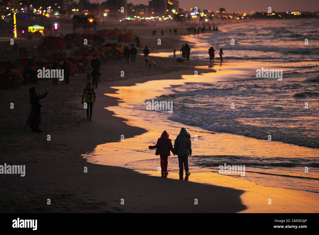 Palestinians enjoying the sunset on the beach of Gaza City. Palestine ...