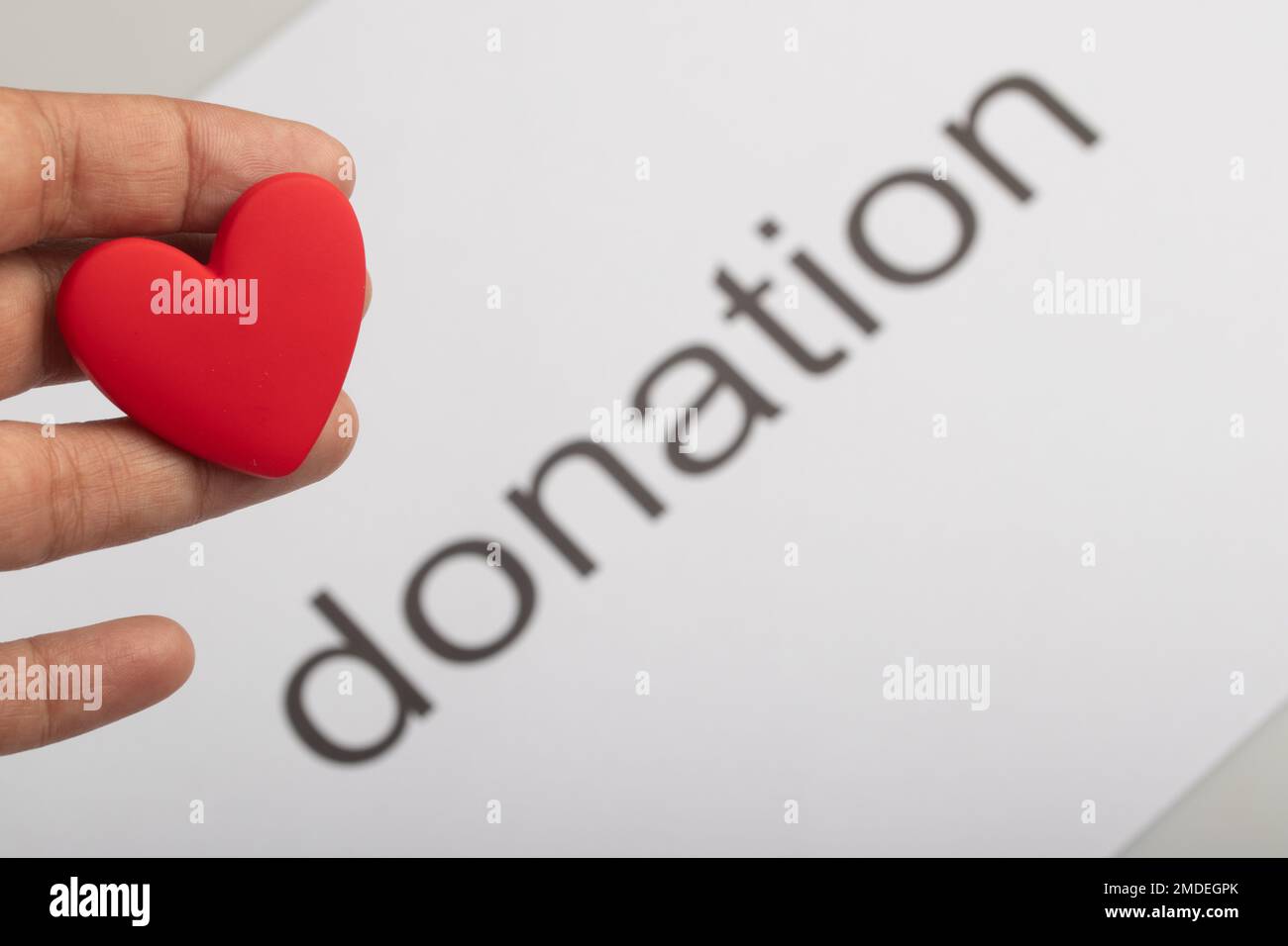 Red heart and donation. Heart donation concept Stock Photo - Alamy