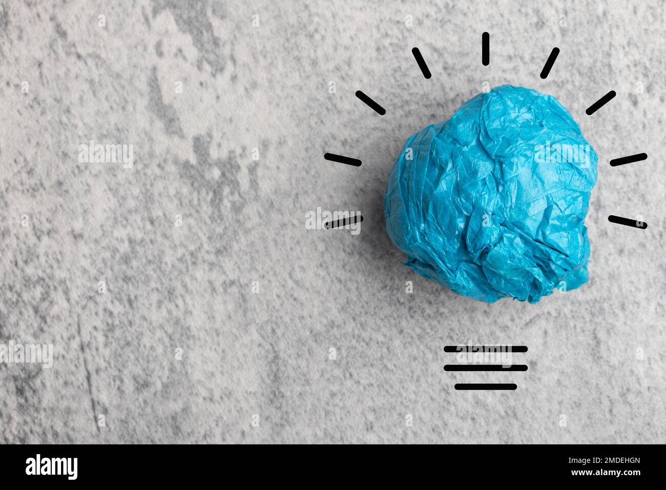 Paper scrap ball blue color with light bulb symbol on gray background ...