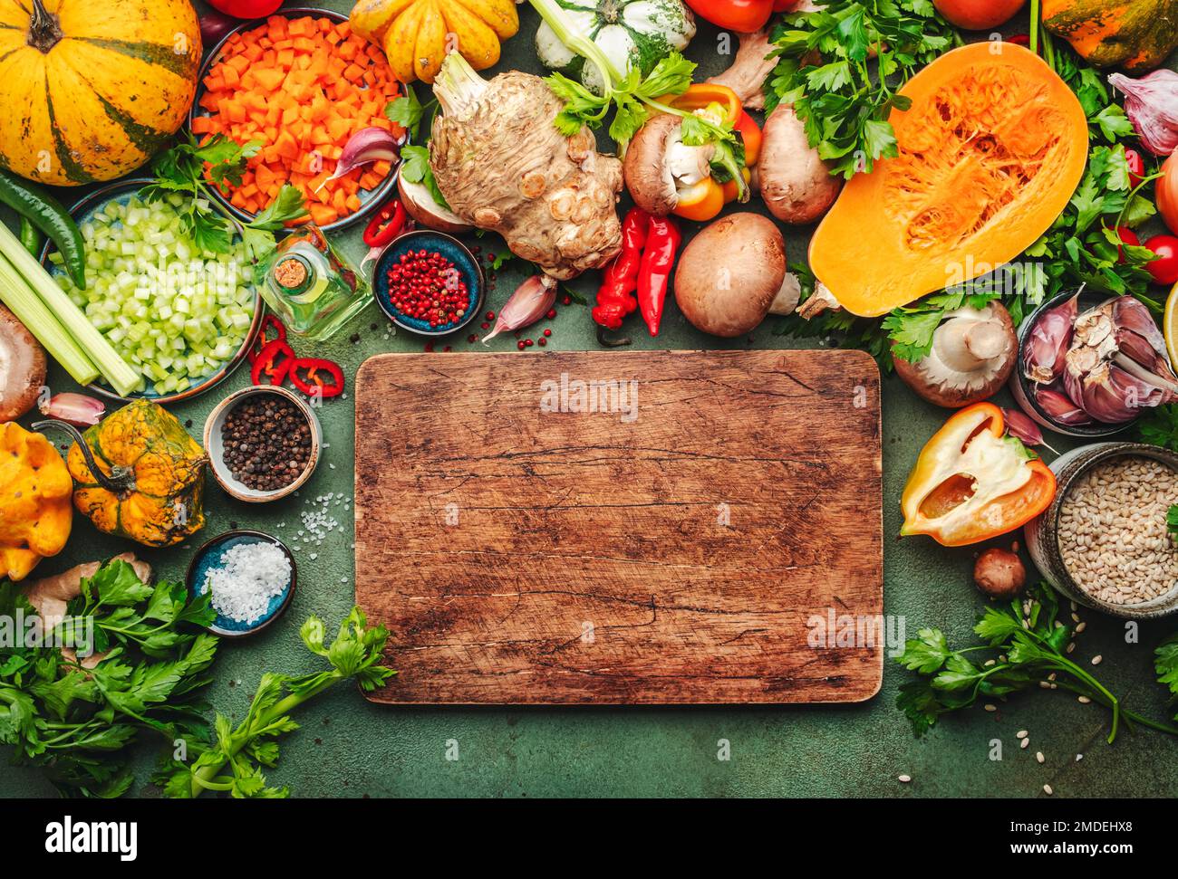 Food background. Rustic wooden cutting board. Vegetables, mushrooms ...
