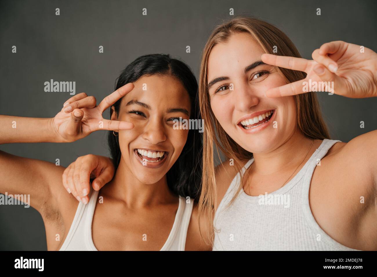 Close up girlfriends very happy making the pieces symbol Stock Photo ...
