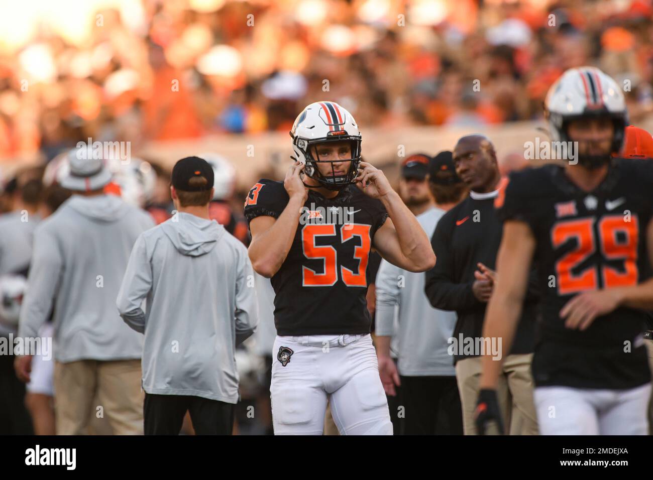Oklahoma State long snapper Matt Hembrough (53) walks the sideline ...