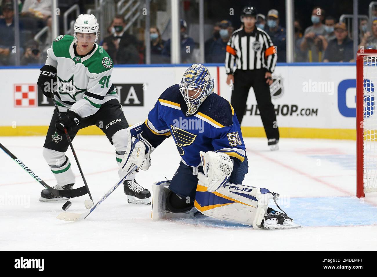St. Louis Blues goaltender Jordan Binnington (50) defends while under ...