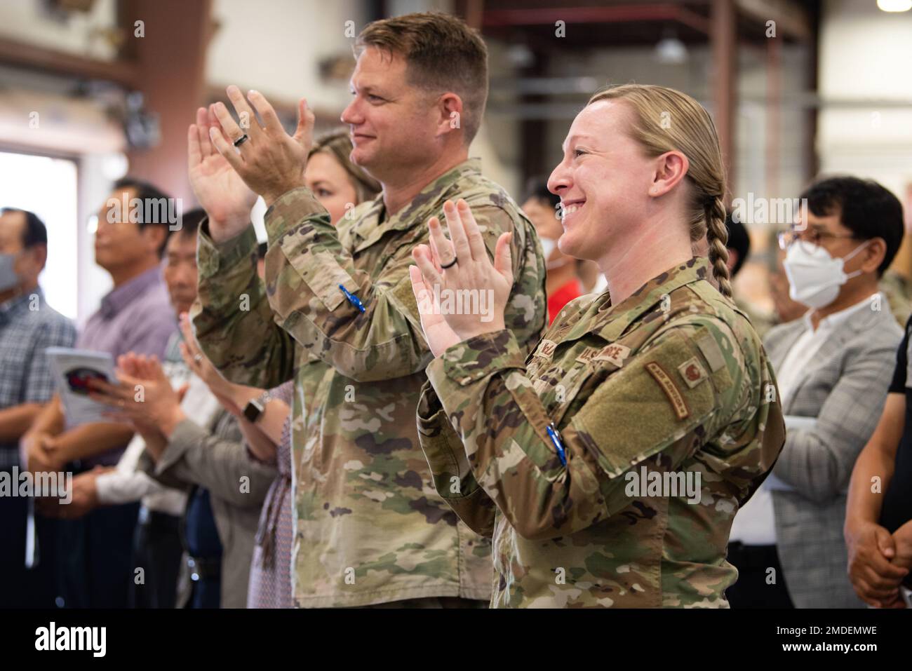 Members of the audience applaud Maj. Vincent McLean, 51st Logistics ...