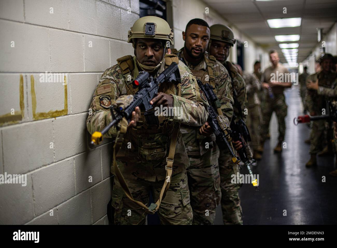 Airman Meshach Cole, left, Senior Airman Antonio Davis, middle, and ...