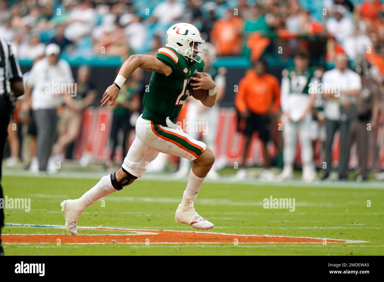 Miami quarterback Jake Garcia (13) runs for a first down during the ...