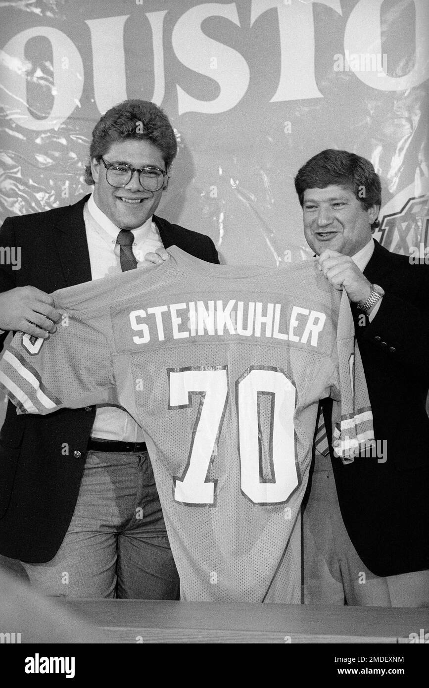 Nebraska blue chip offensive lineman Dean Steinkuhler holds up his new ...