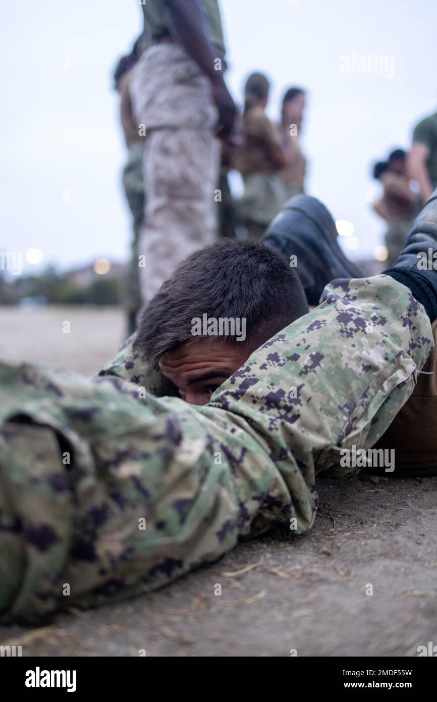 U.S. Naval Academy midshipmen conduct squad push-ups during ...