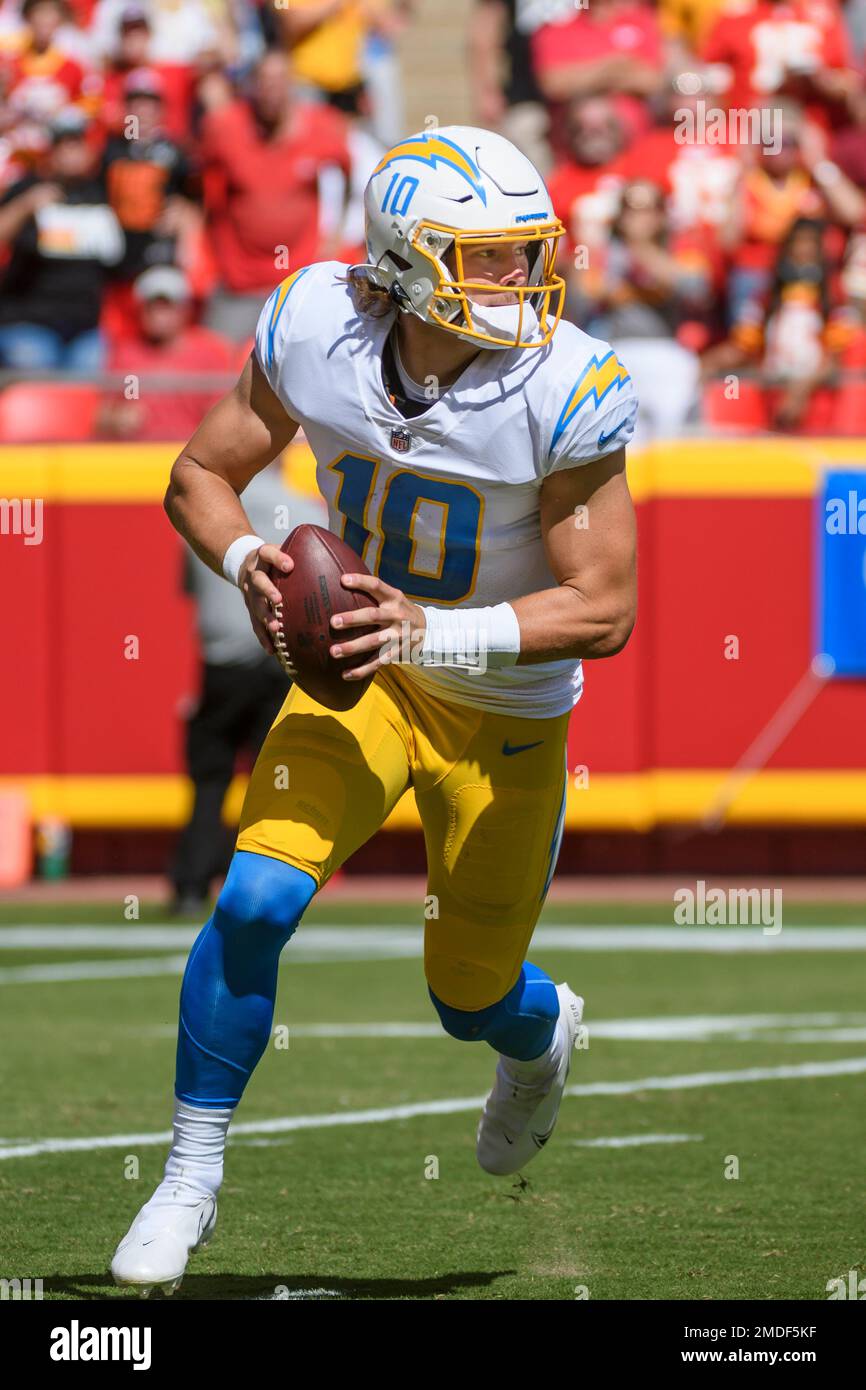 Los Angeles Chargers quarterback Justin Herbert scrambles away from the ...