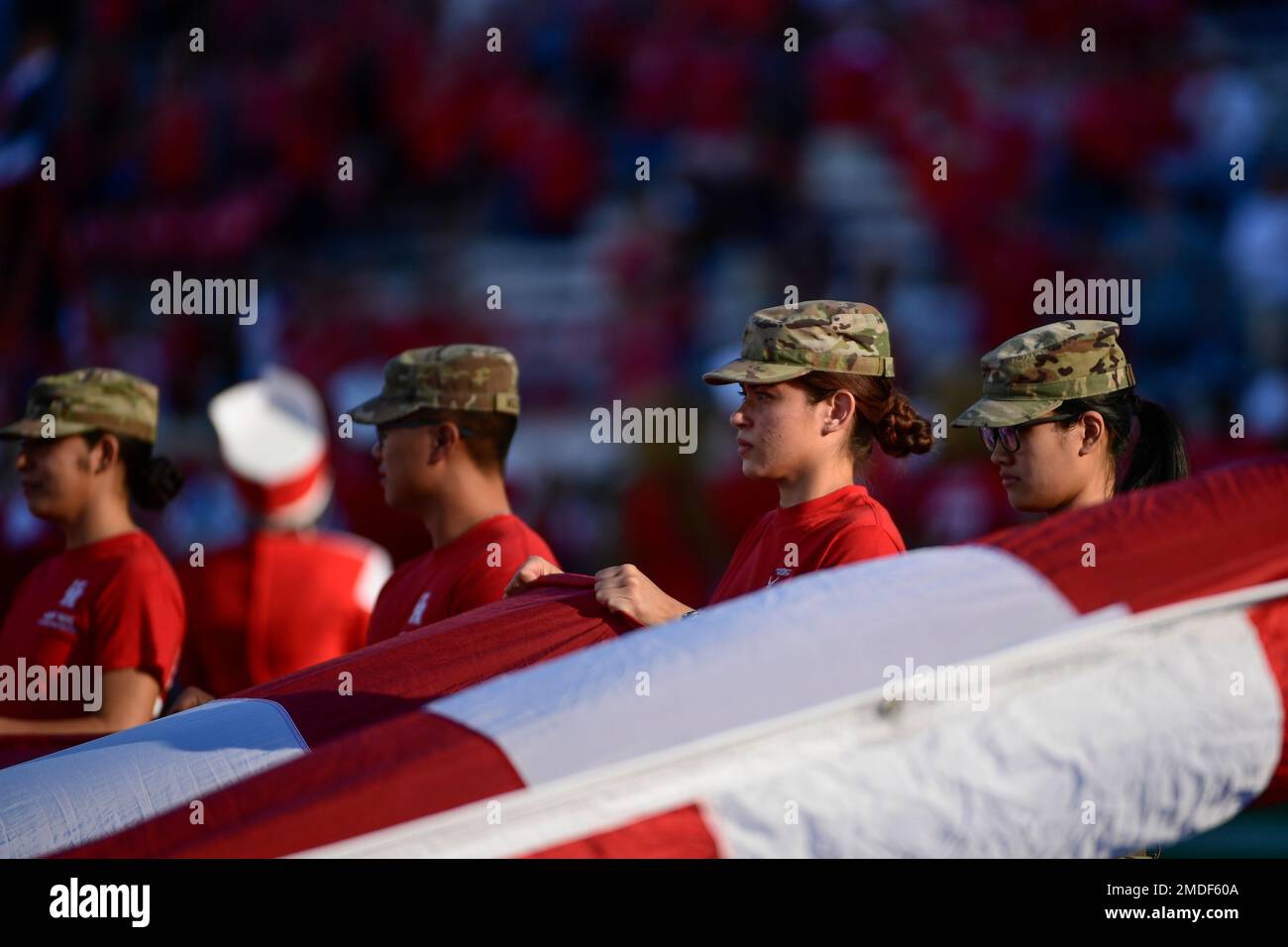 University of Houston ROTC member hold an American flag during the ...
