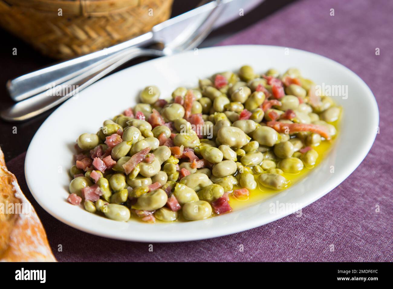 Beans with ham, traditional tapa recipe from Barcelona in Spain Stock ...