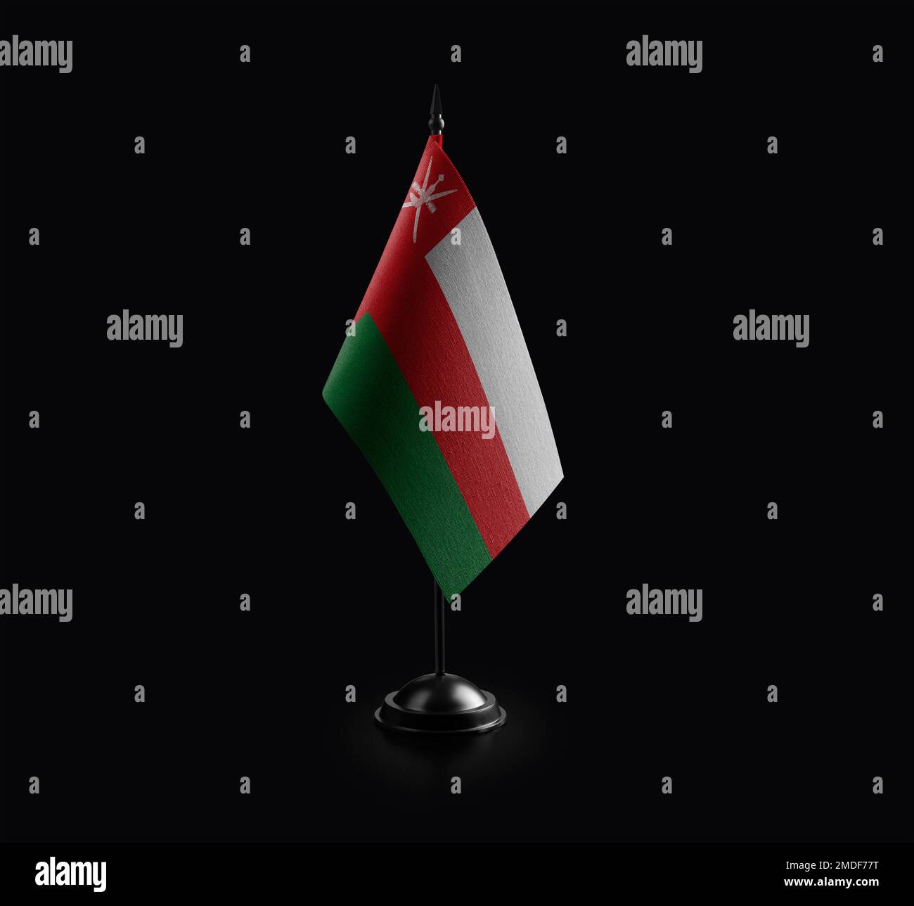Small national flag of the Oman on a black background Stock Photo - Alamy