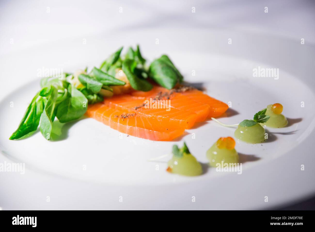 Marinated salmon sashimi with lime sauce Stock Photo - Alamy