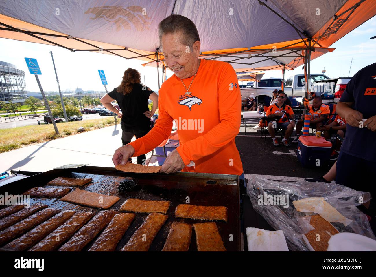 Denver Broncos fan Henry Alire, of Pueblo, Co., tailgates prior to an ...