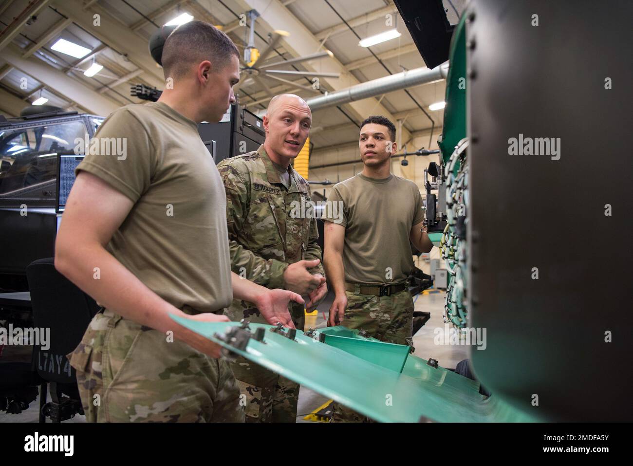 U.S. Army Pfc. Brady Peckinpaugh (left), a student at the 128th ...