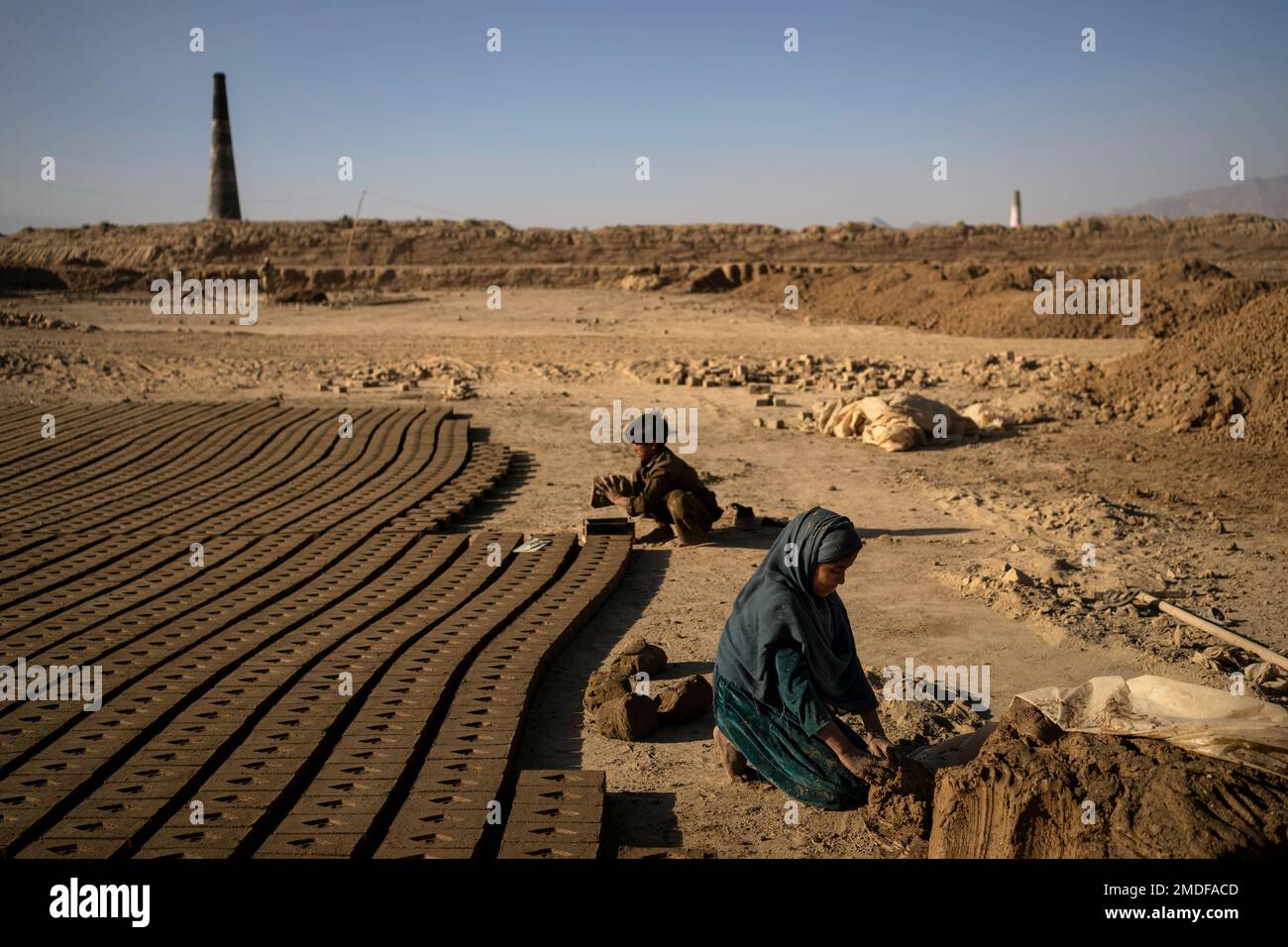 Afghan children work at a brick factory in Deh Sabz, on the outskirts ...