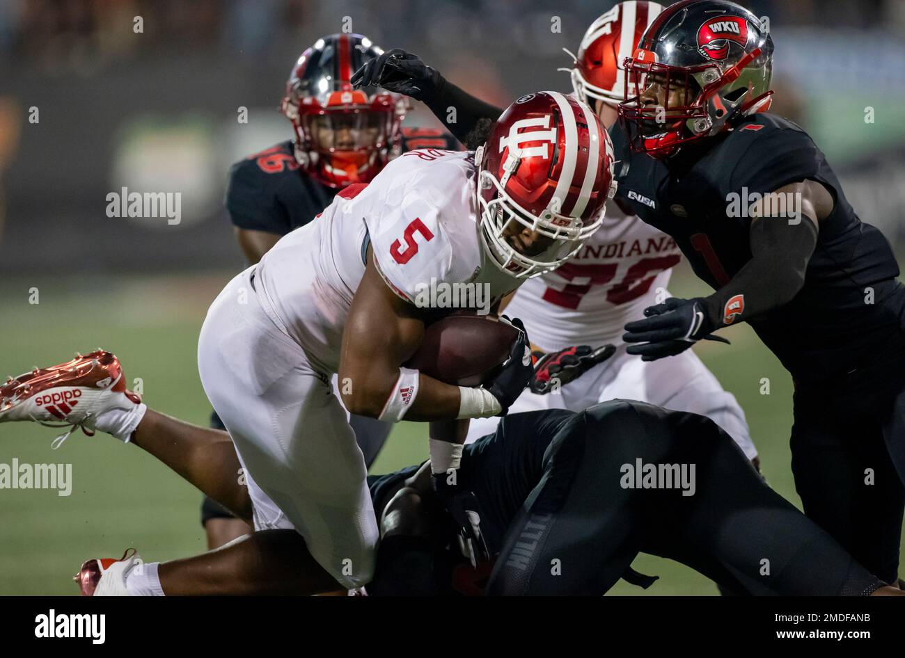 Western Kentucky University defensive back Antwon Kincade, right, helps ...