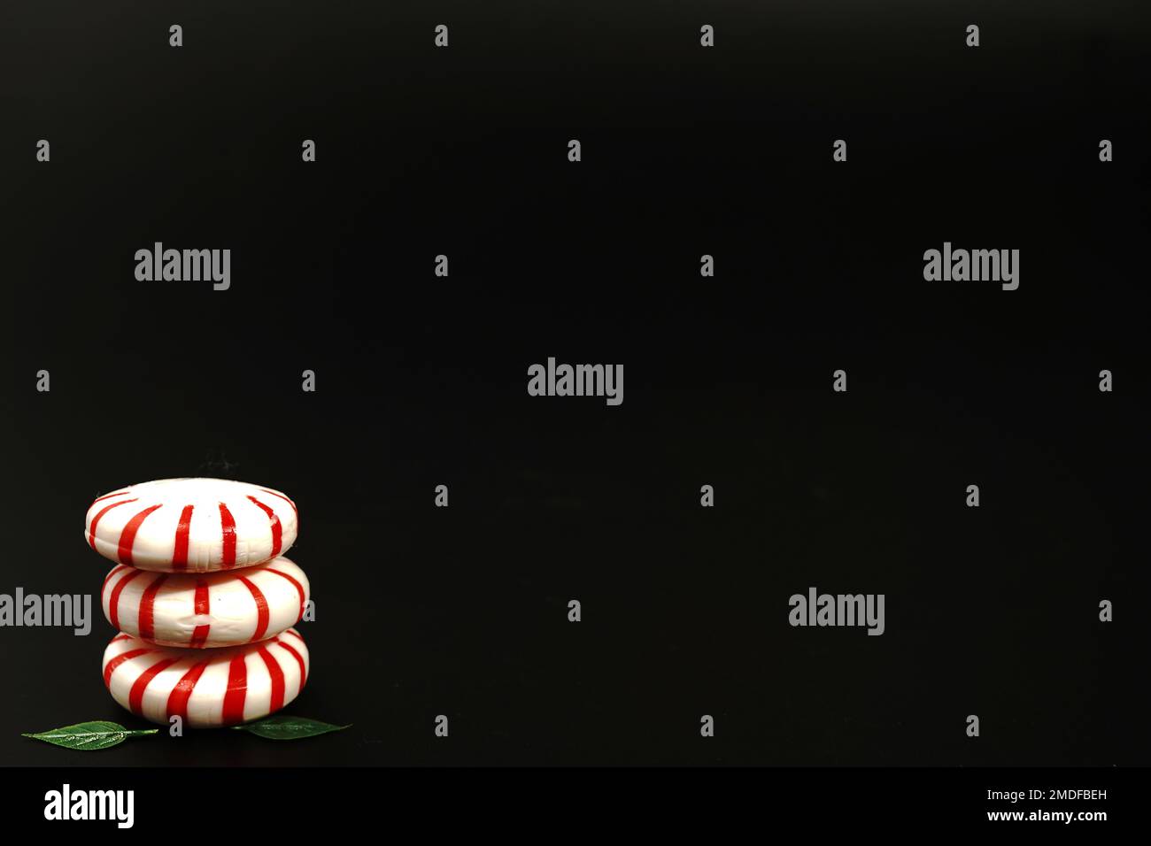 Fresh peppermint candy stacked hard candy black background Stock Photo ...