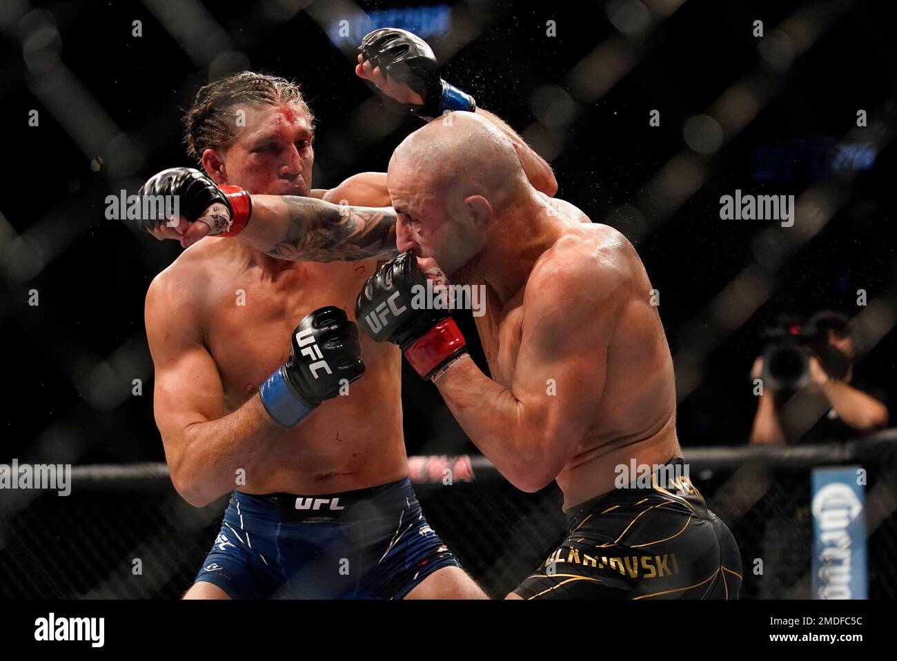 Alexander Volkanovski, right, exchanges punches with Brian Ortega ...