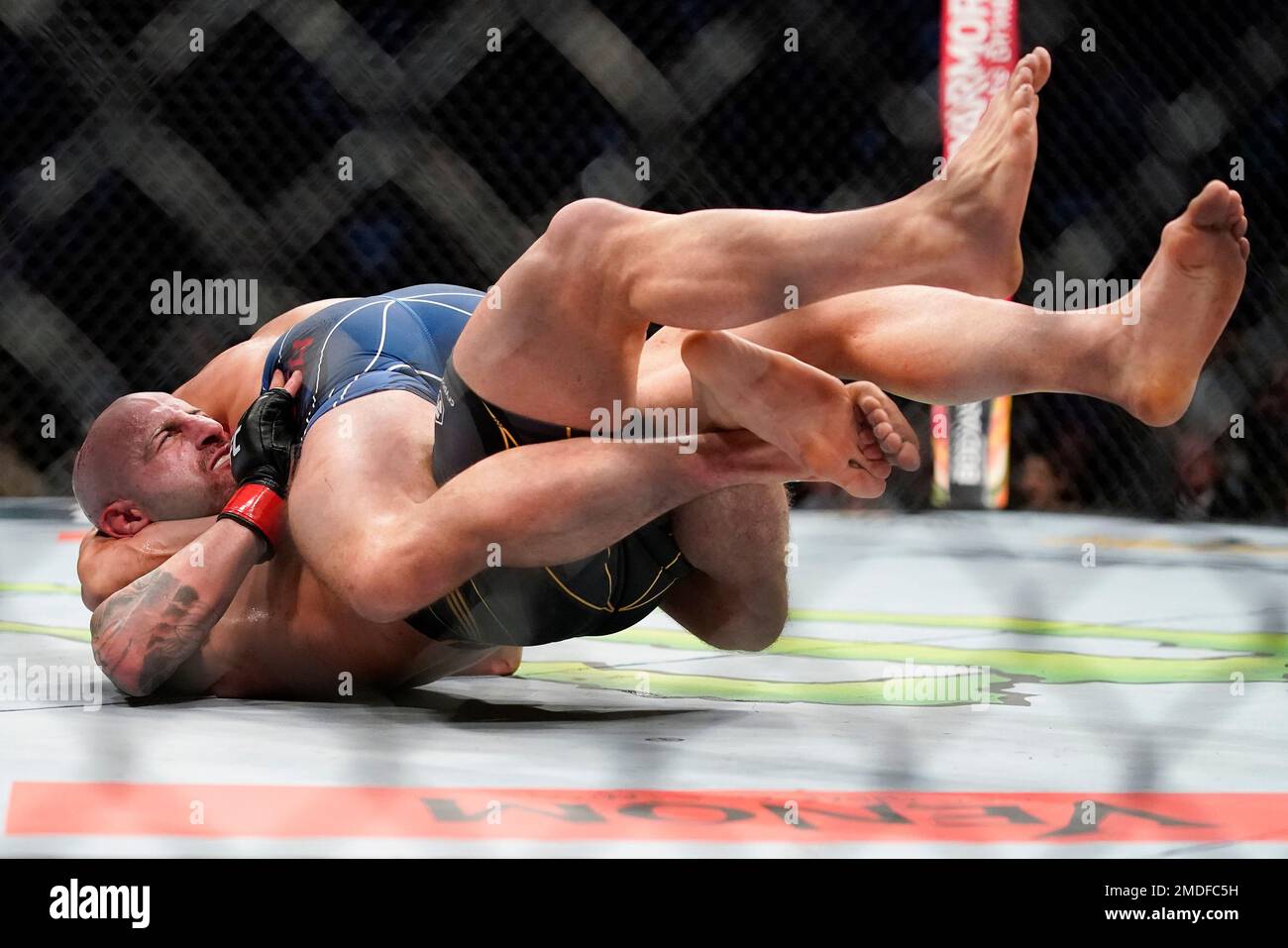 Alexander Volkanovski, left, wrestles with Brian Ortega during a ...