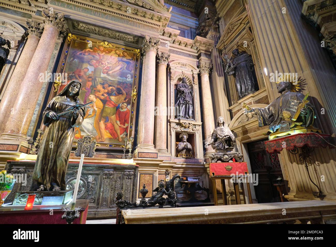 One of the side alcoves, full of marble and statues, designed by ...