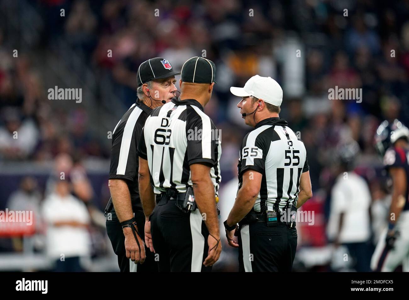 NFL officials, down judge Mike Carr (63) referee Alex Kemp (55) get ...