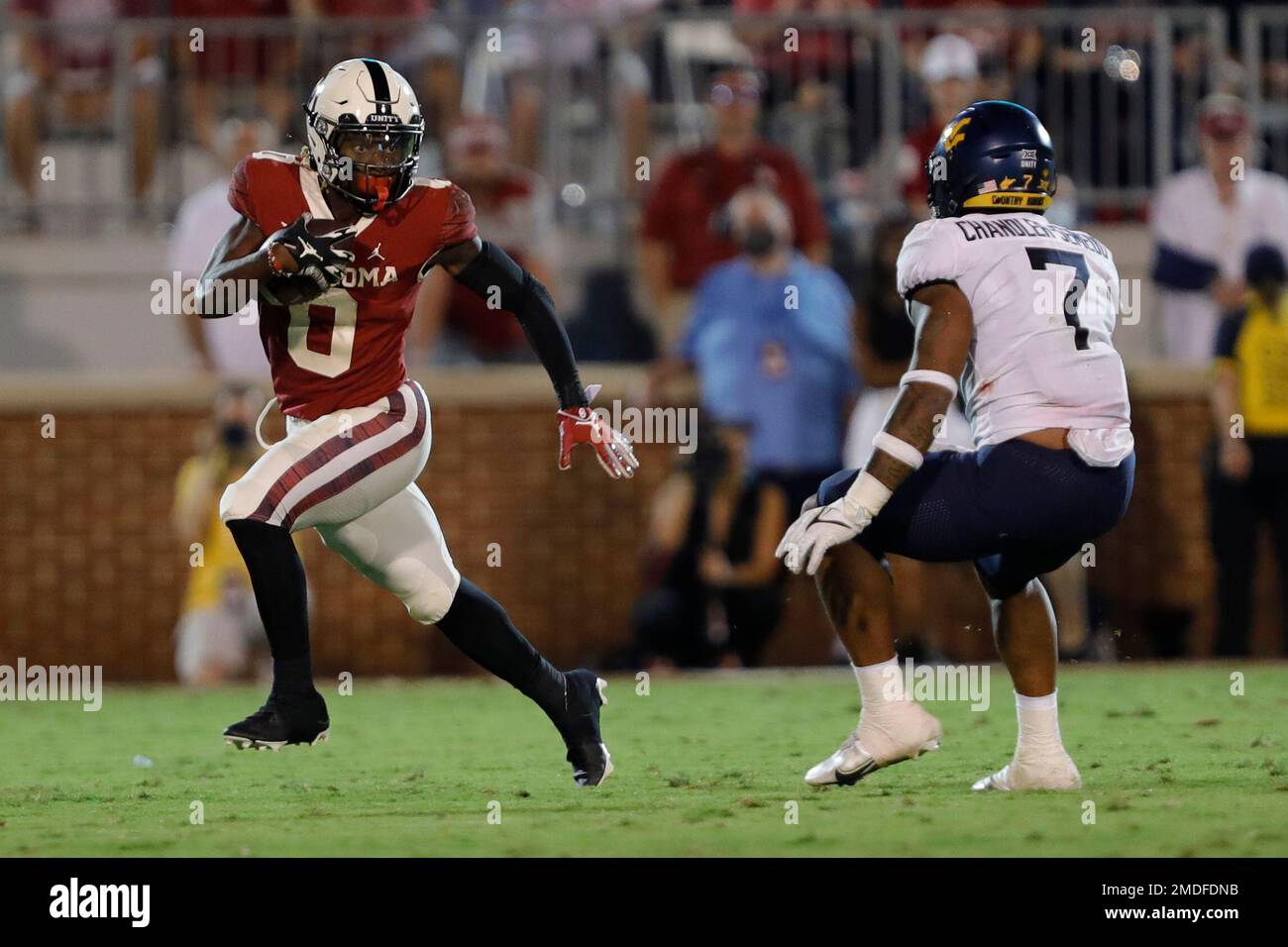 Oklahoma running back Eric Gray (0) runs ahead of West Virginia ...
