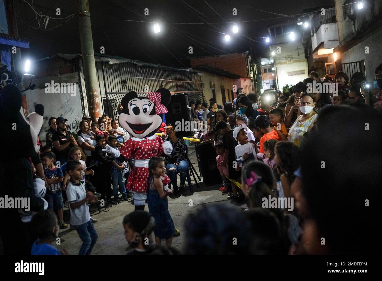 A woman dressed as the Disney character Minnie Mouse performs in the 23 ...