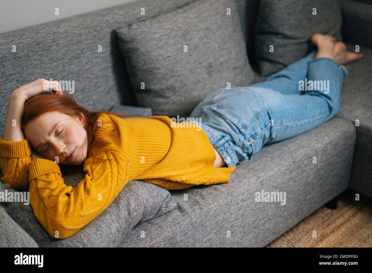 Asleep lying down sofa hi-res stock photography and images - Alamy