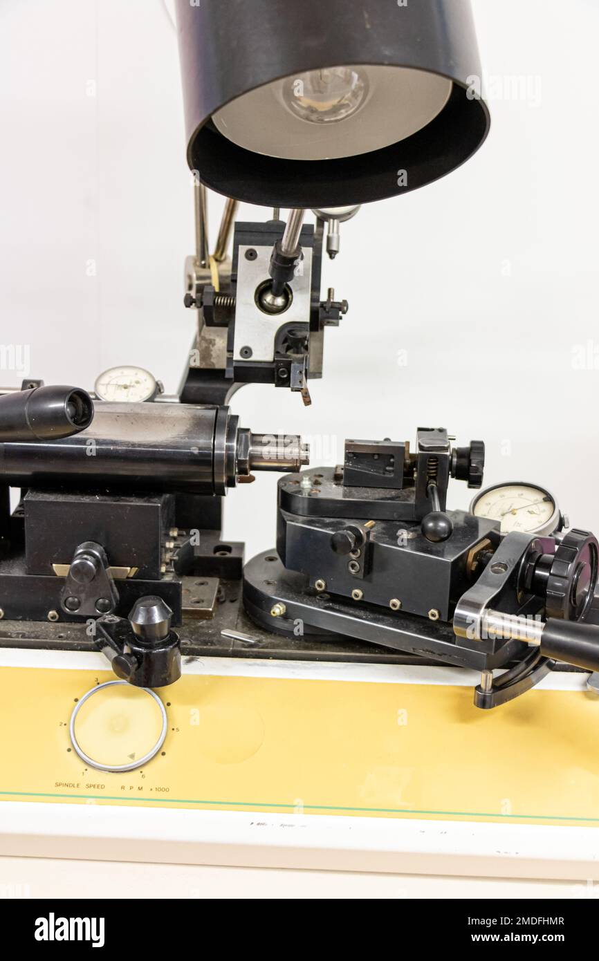 Manually operated lathe for making contact lenses Stock Photo - Alamy