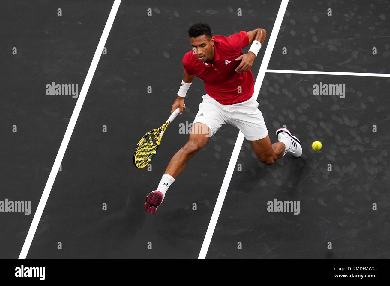 Team World's Felix Auger-Aliassime, of Canada, returns the ball to Team ... Team World's Felix Auger-Aliassime, of Canada, returns the ball to Team ...