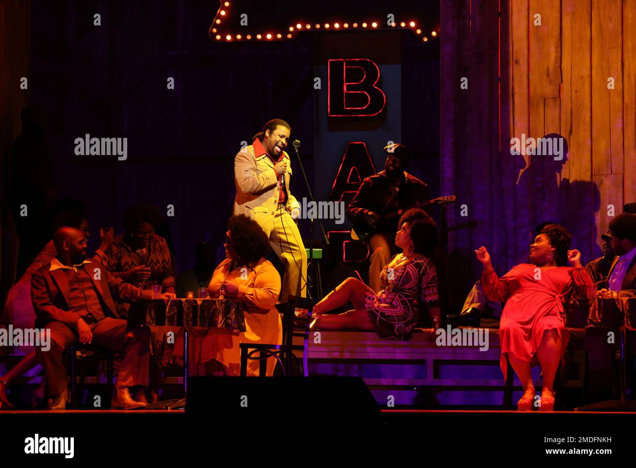 Chauncey Packer, standing center, and cast members perform during a ...