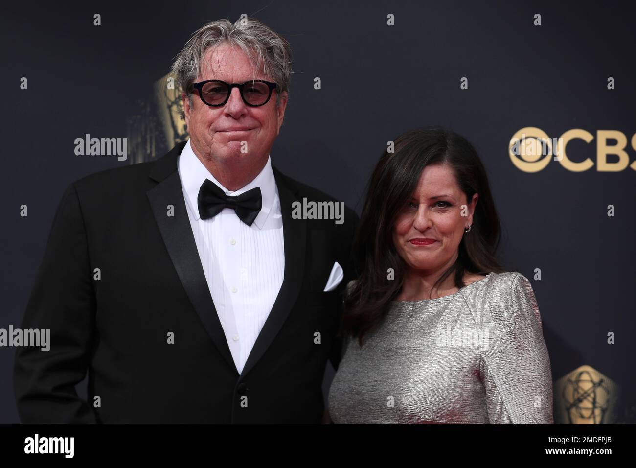 Andy Tennant, left, and Sharon Johnson-Tennant arrive at the 73rd Emmy ...