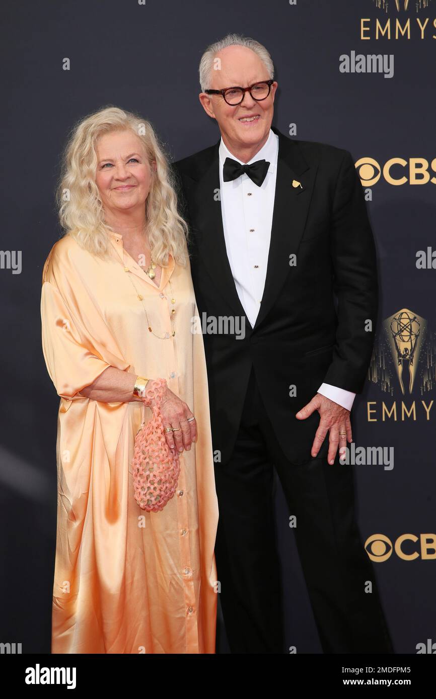 Mary Yeager, left, and John Lithgow arrives at the 73rd Emmy Awards at ...