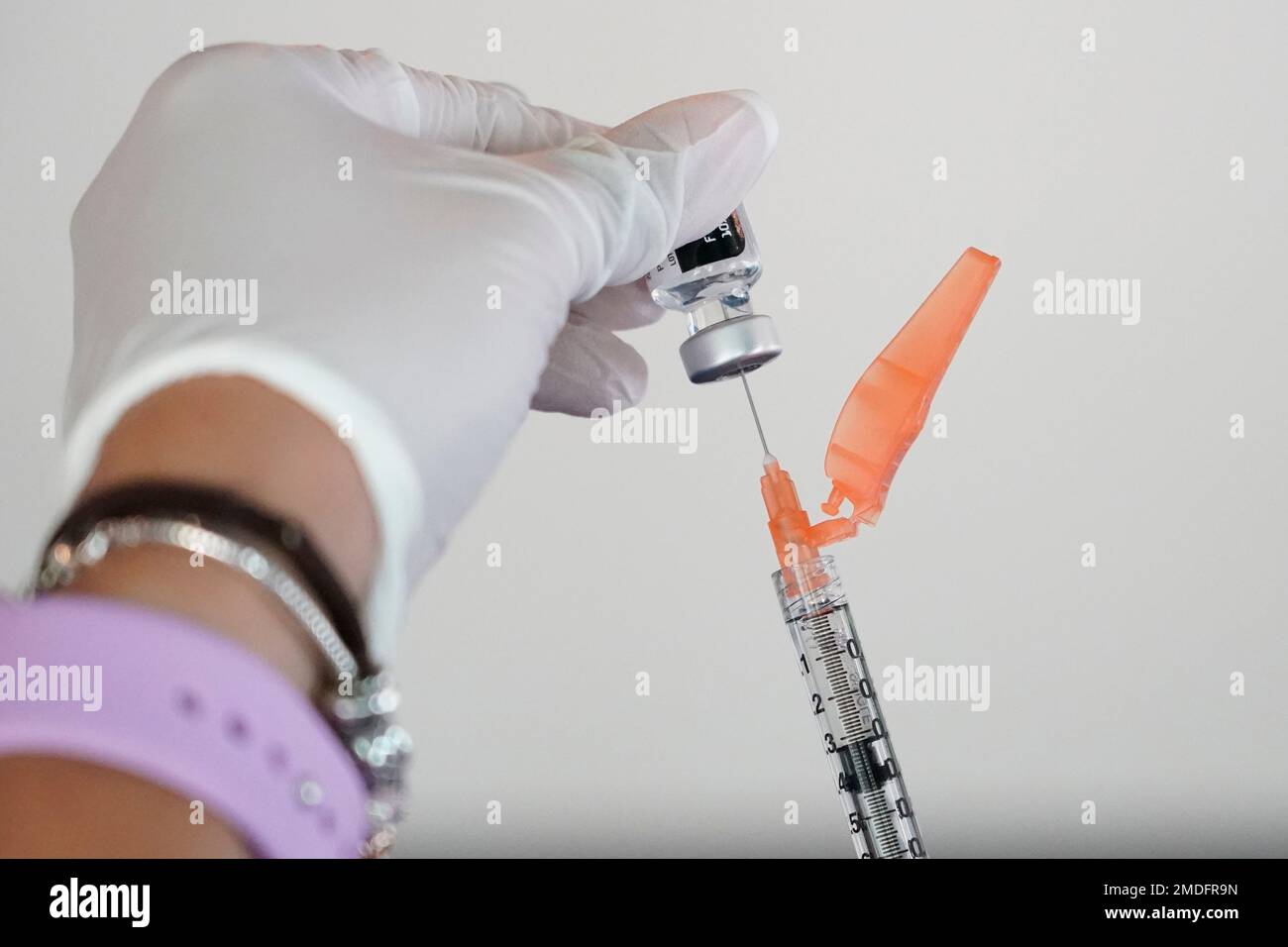 FILE - In this Tuesday, Sept. 21, 2021 file photo, a nurse loads a ...