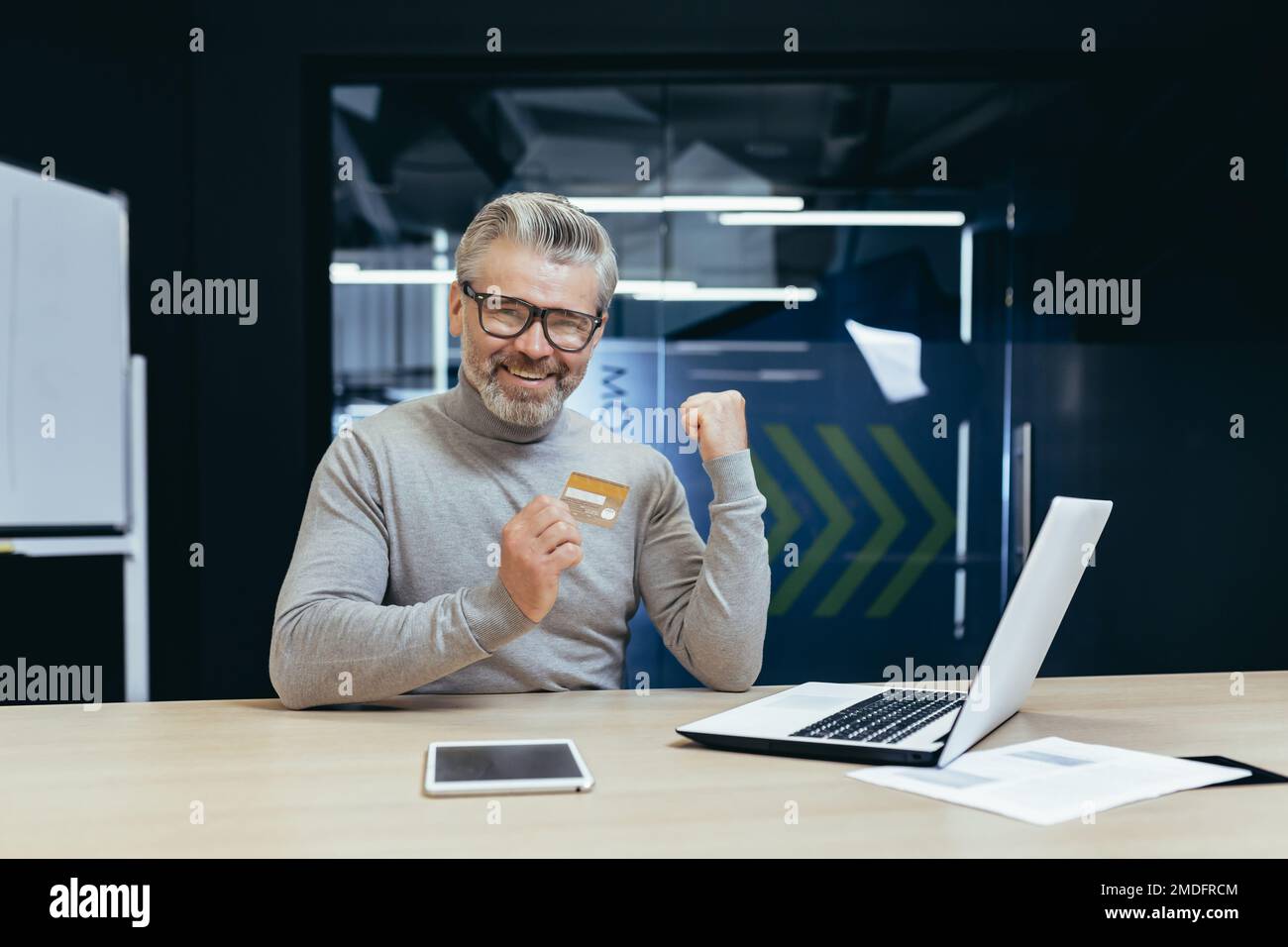 Successful gray haired businessman rejoices and celebrates completion ...