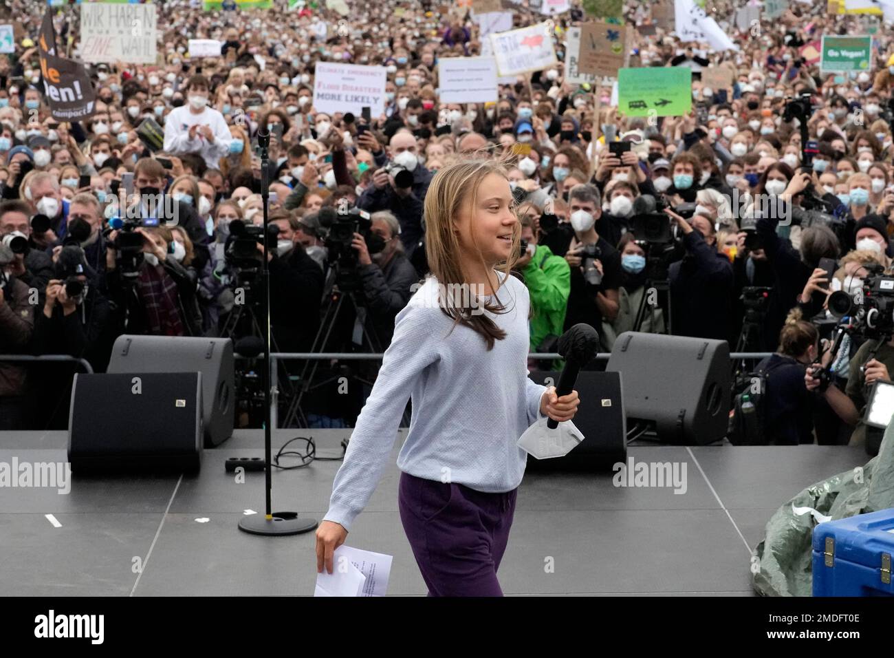 Swedish climate activist Greta Thunberg walks on stage during a Fridays ...