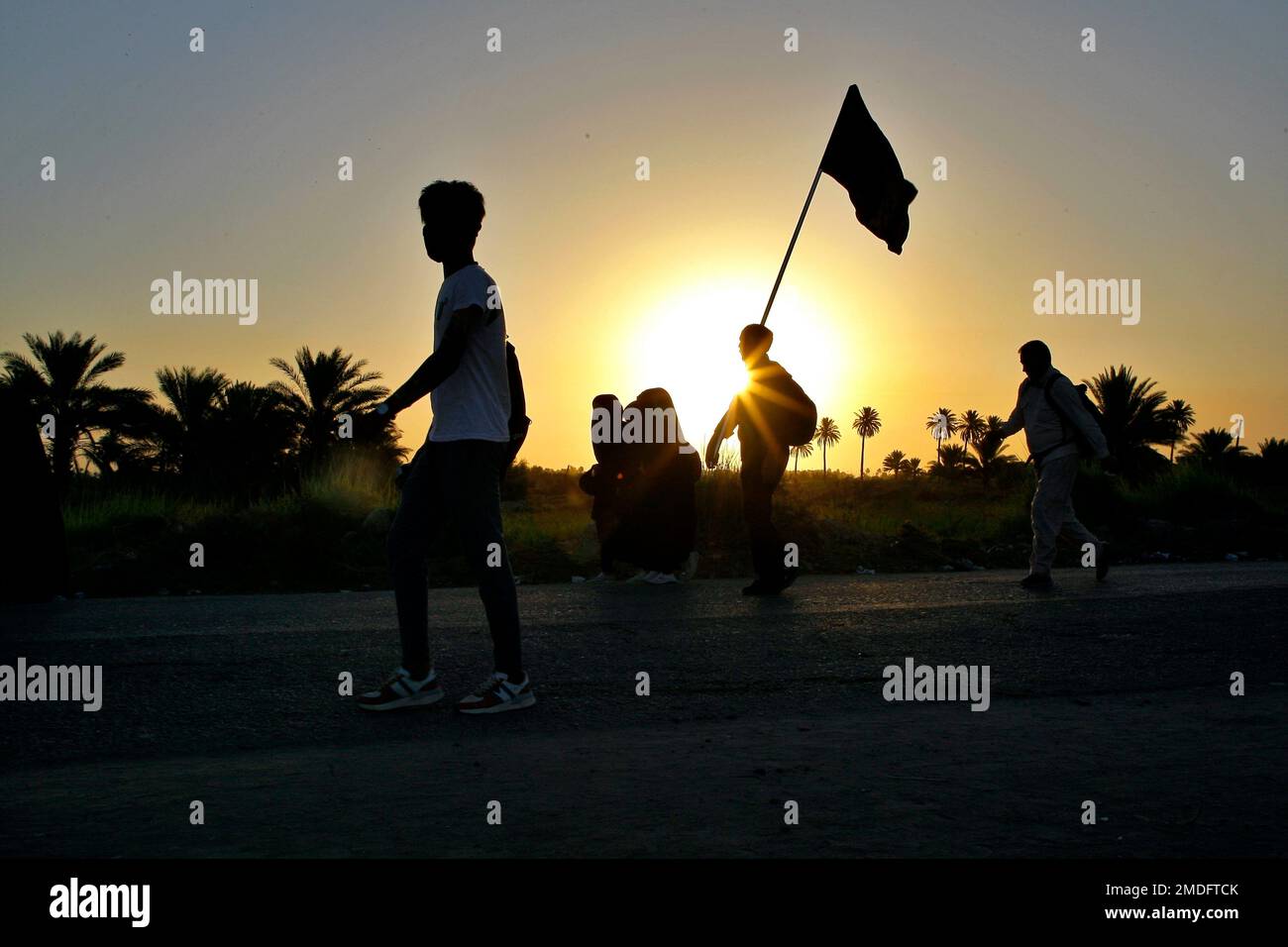 Shiite pilgrims march to the holy shrine of Imam Hussein for the ...
