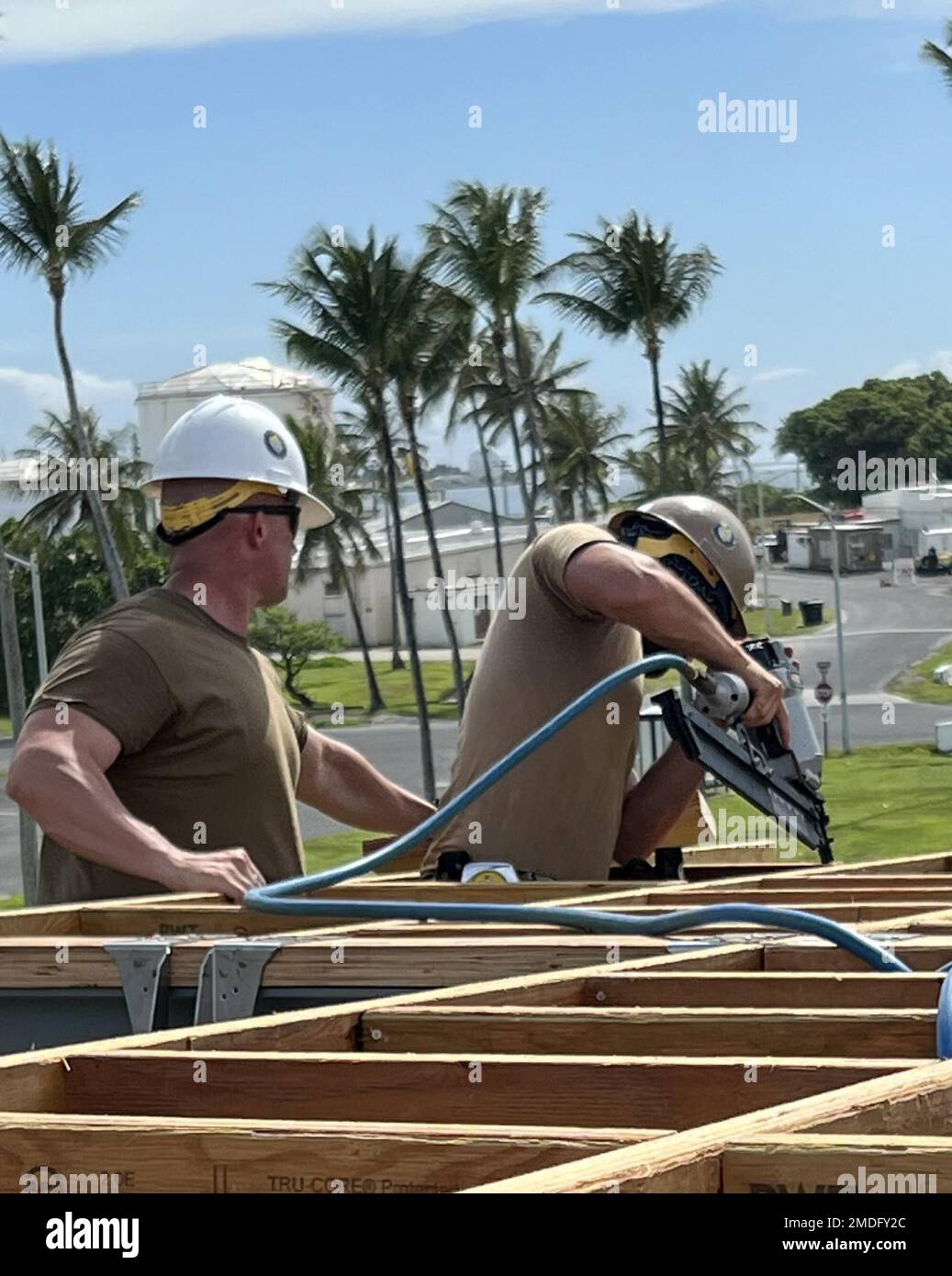Kwajalein Atoll, Marshall Islands (July 22, 2022) Builder Chief Petty Officer Eric Clark and ...