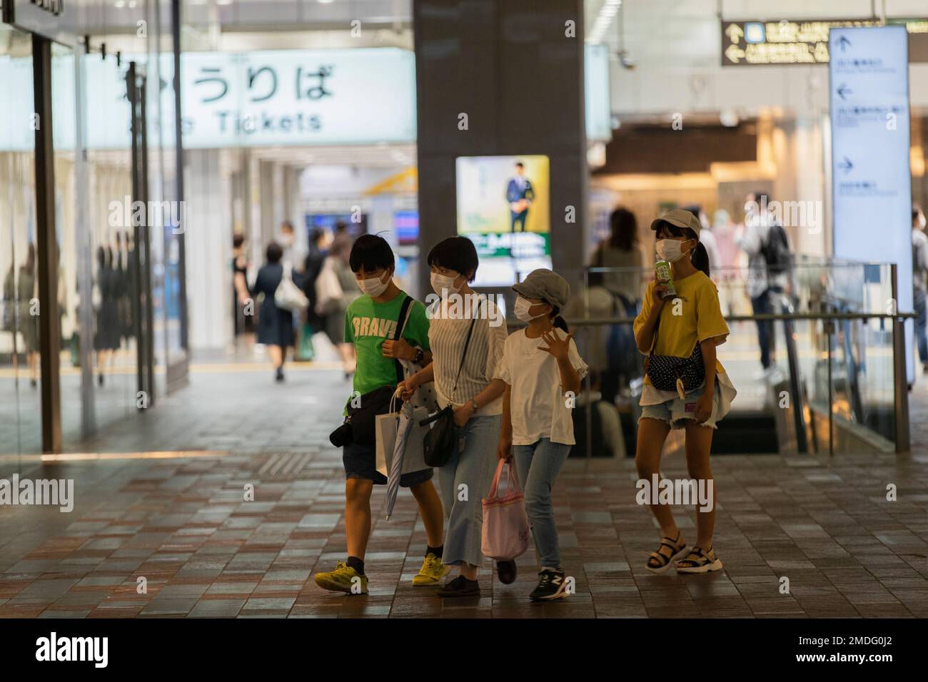 People leave Tokyo station Thursday, Sept. 23, 2021. (AP Photo/Hiro ...