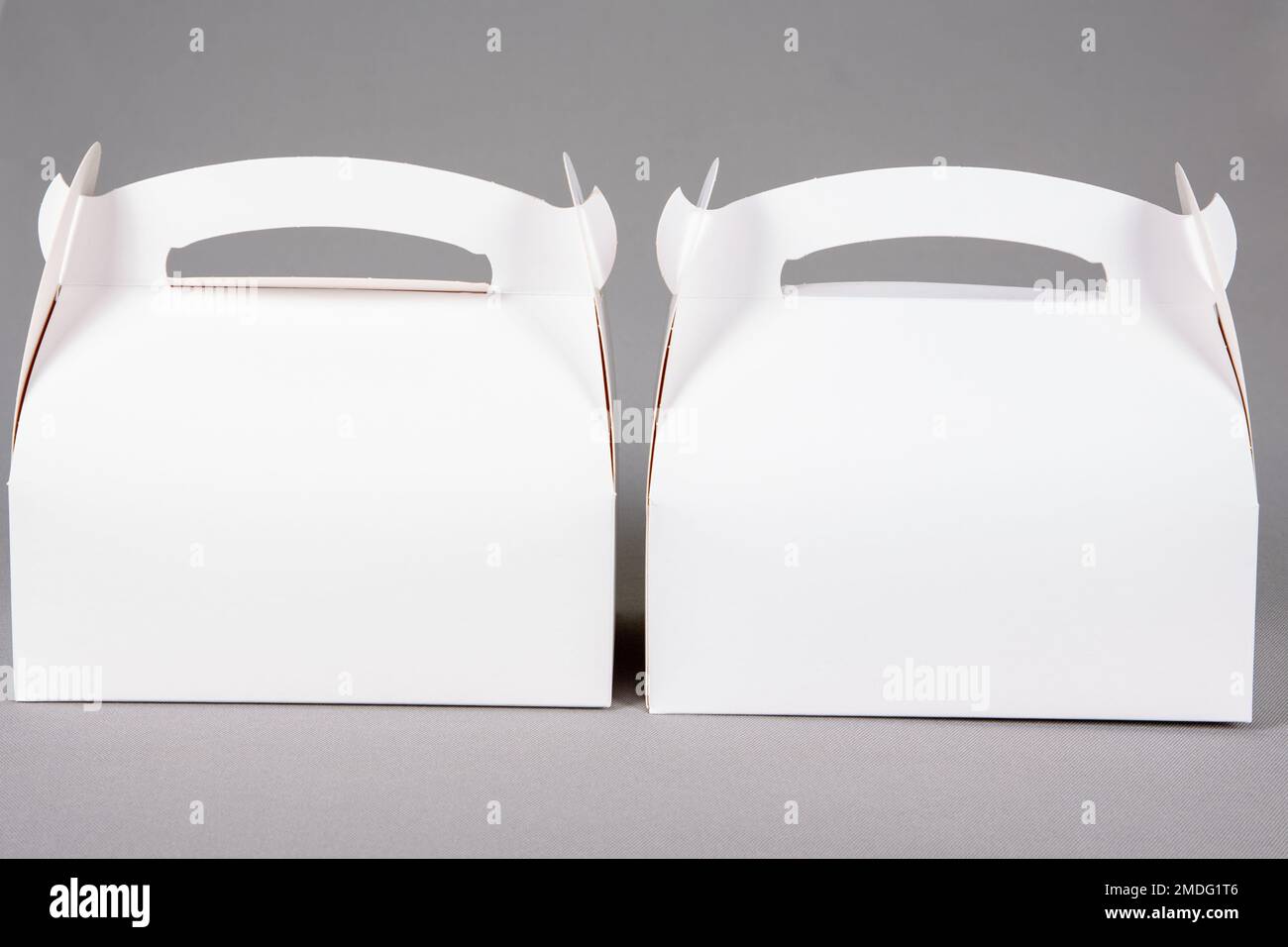 two mockup white blank paper packaging for bakery large and small box ...