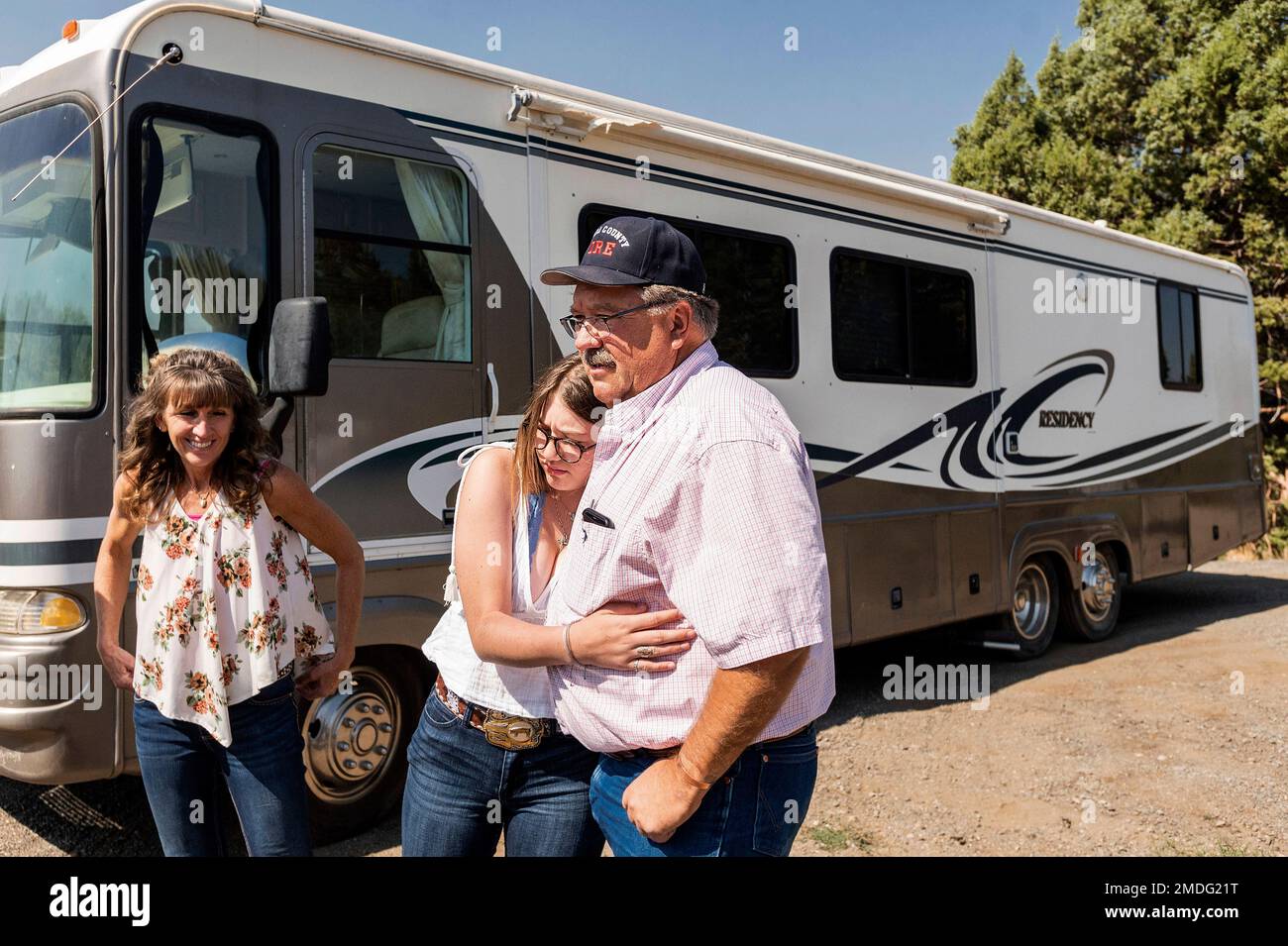Paul Roen gets a hug from daughter Aubree Roen, 16, as his family ...