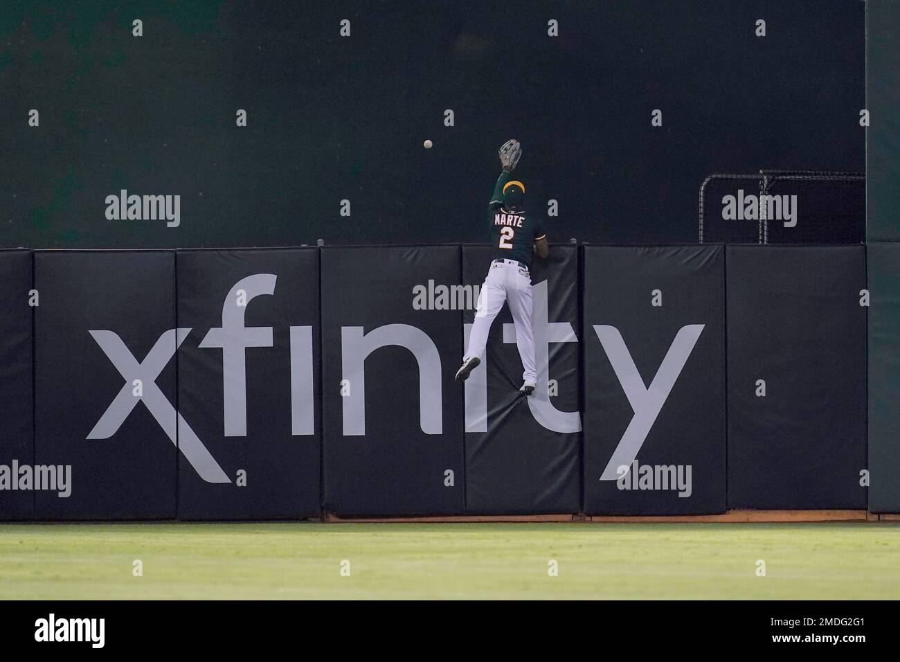 Oakland Athletics center fielder Starling Marte (2) cannot catch a home ...