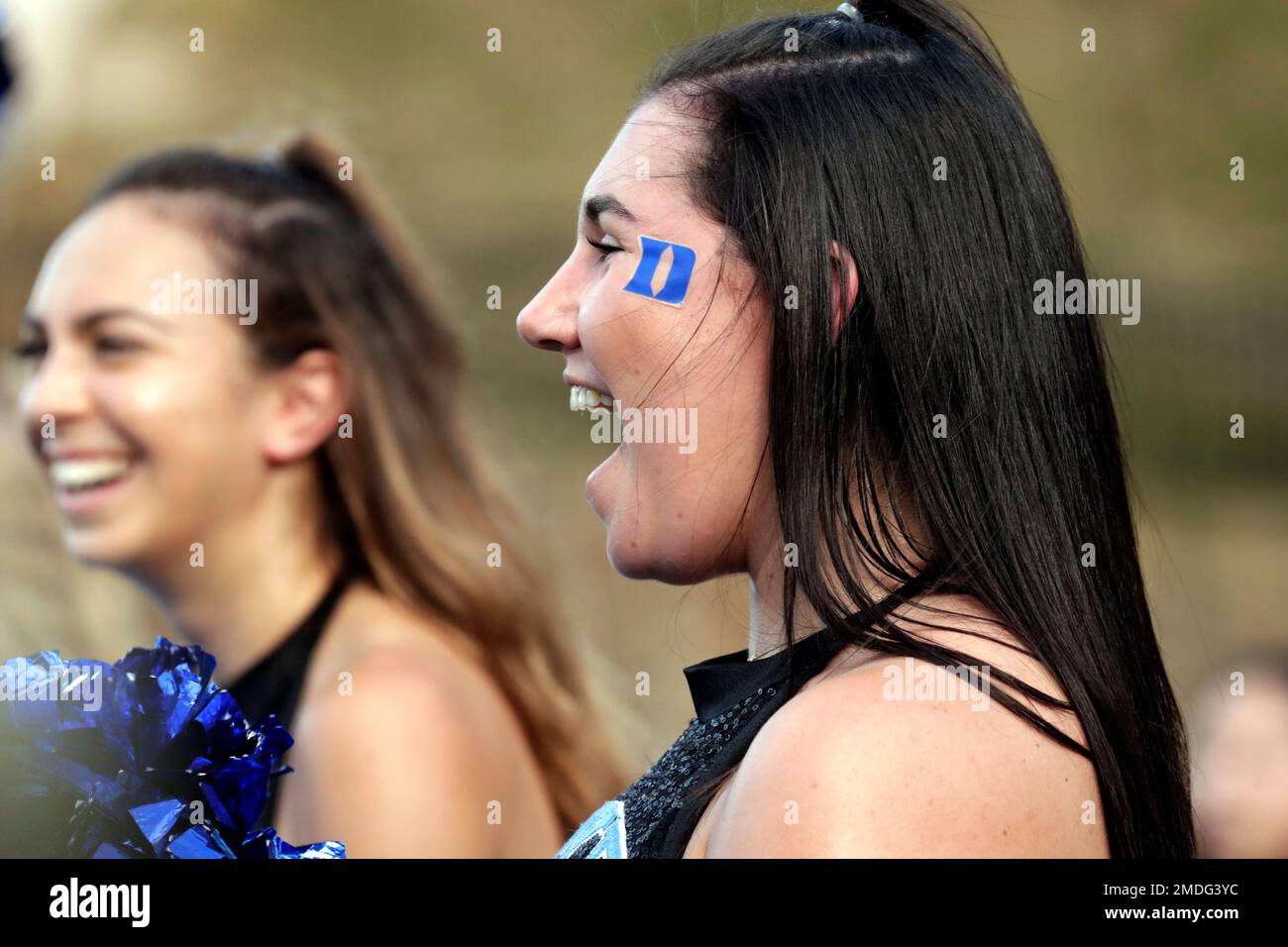 Dancing Devil dance team member Lara Bamberger, right, cheers Duke on ...