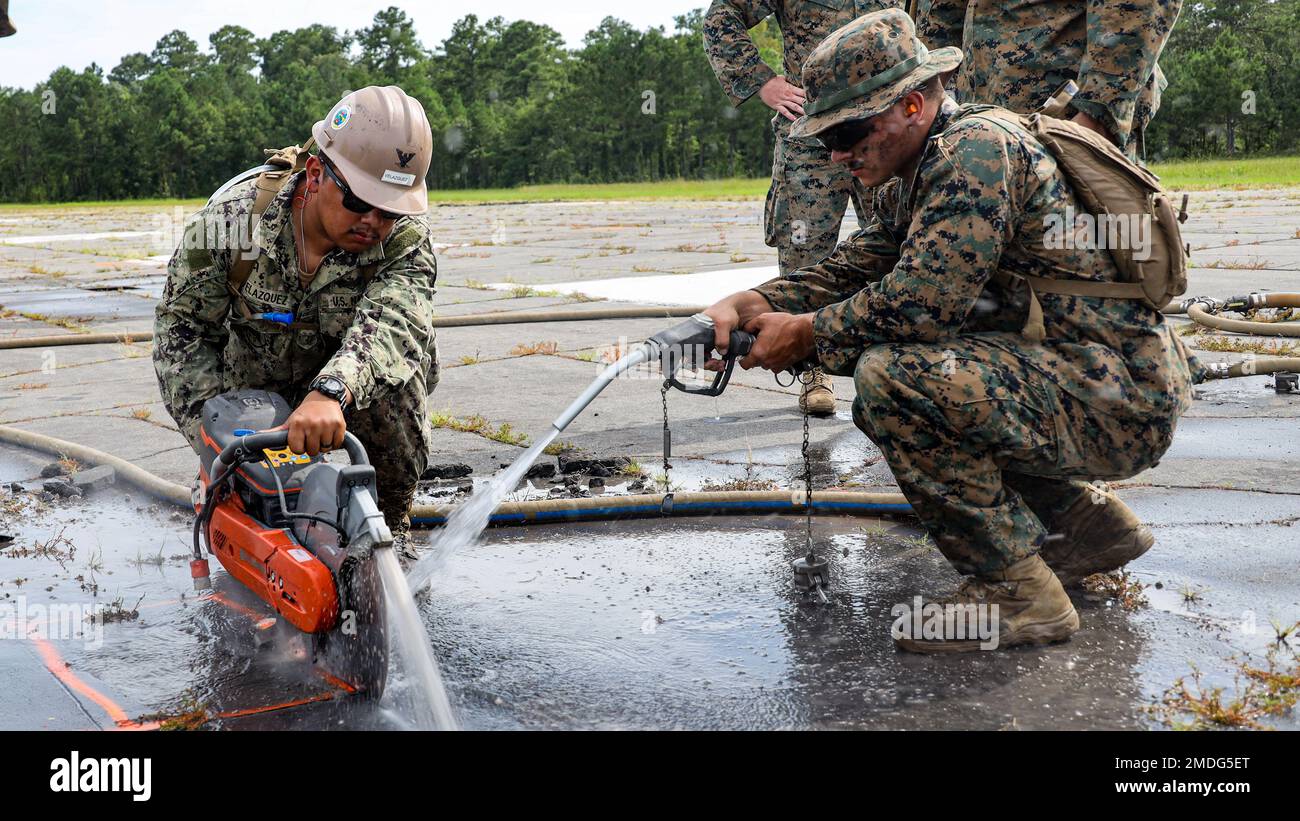 U.S. Navy Builder 3rd Class Mauricio Velazquez, with Naval Mobile ...