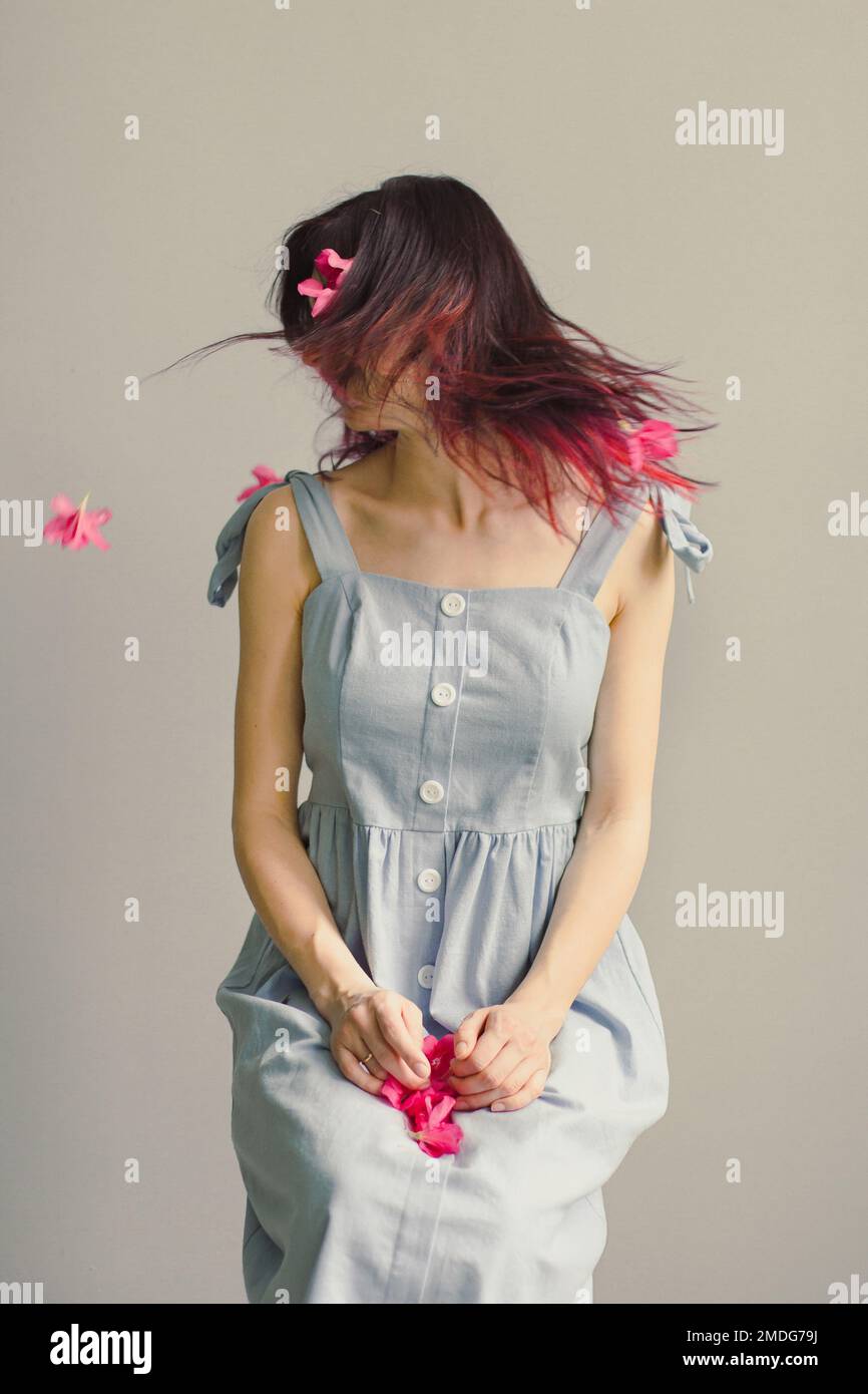 Close up woman shaking head with pink flowers portrait picture Stock ...