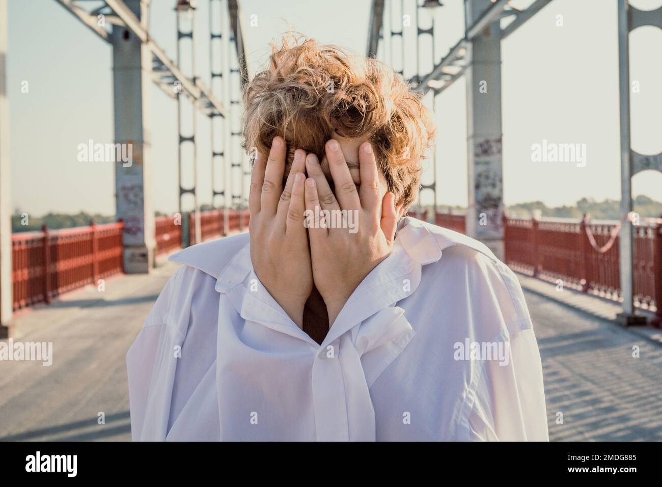 Close up short haired woman covering face with hands portrait picture ...